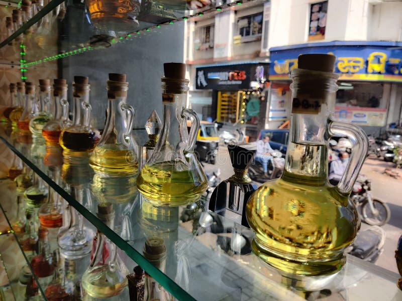 Perfume Bottles for Display on Glass Racks Attractive Bottles Stock ...