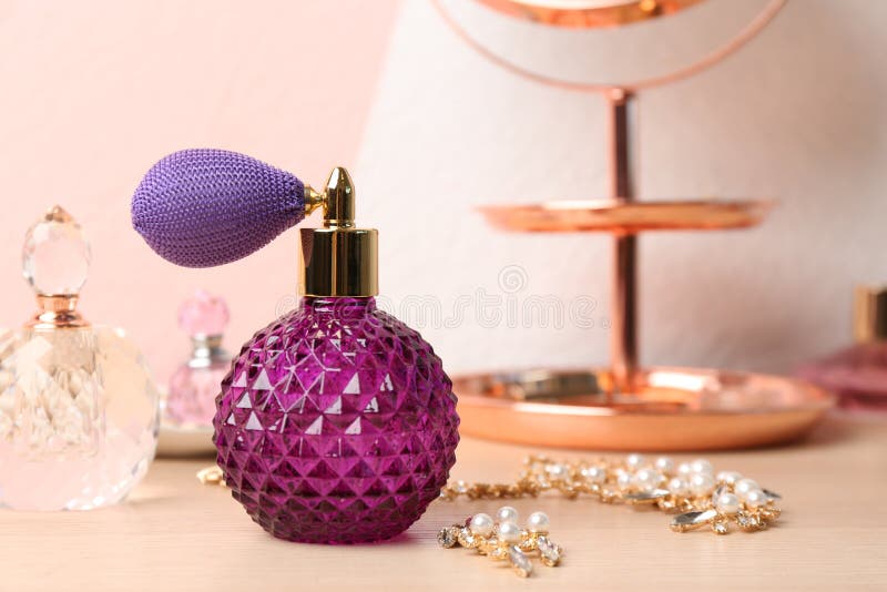 Perfume Bottles and Jewellery on Table Stock Image - Image of glamour ...