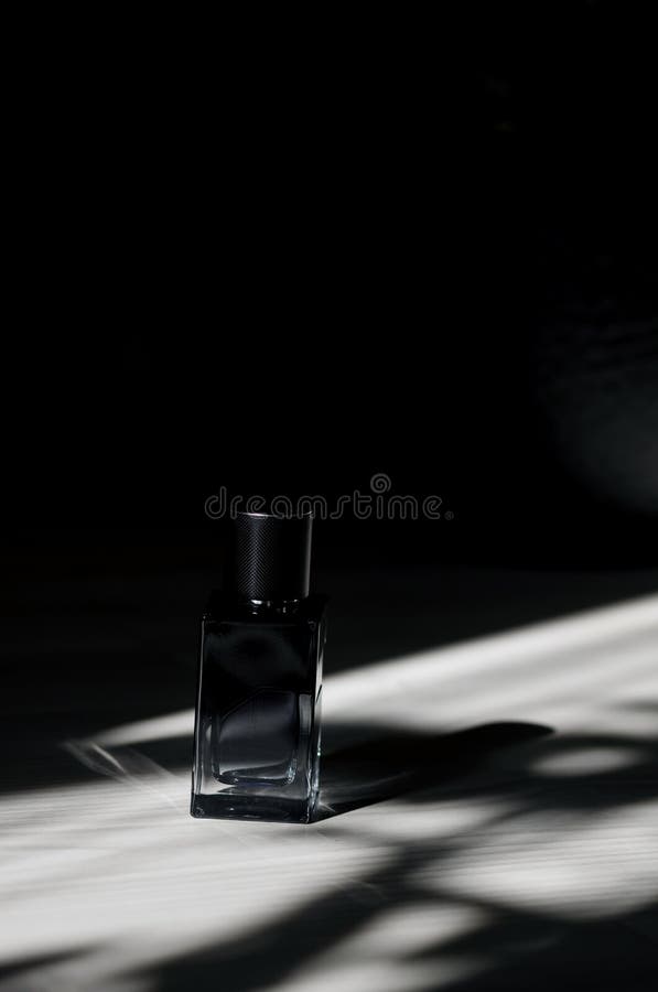 Perfume in a dark style stock photo. Image of aroma - 264871002