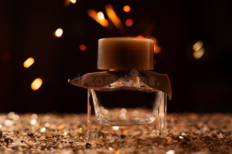 Perfume in gold tones stock photo. Image of bright, cosmetics - 66781444