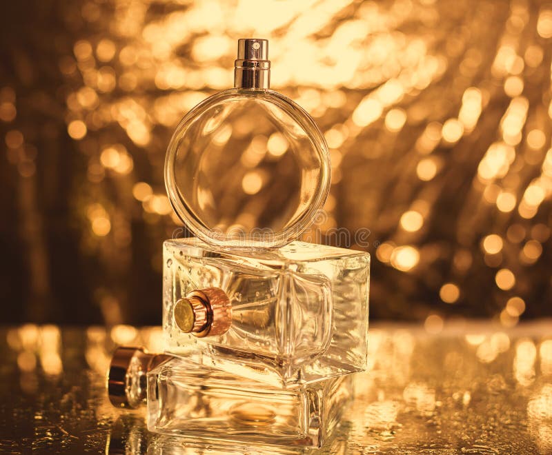 Perfume in gold background stock image. Image of feminine - 89711323