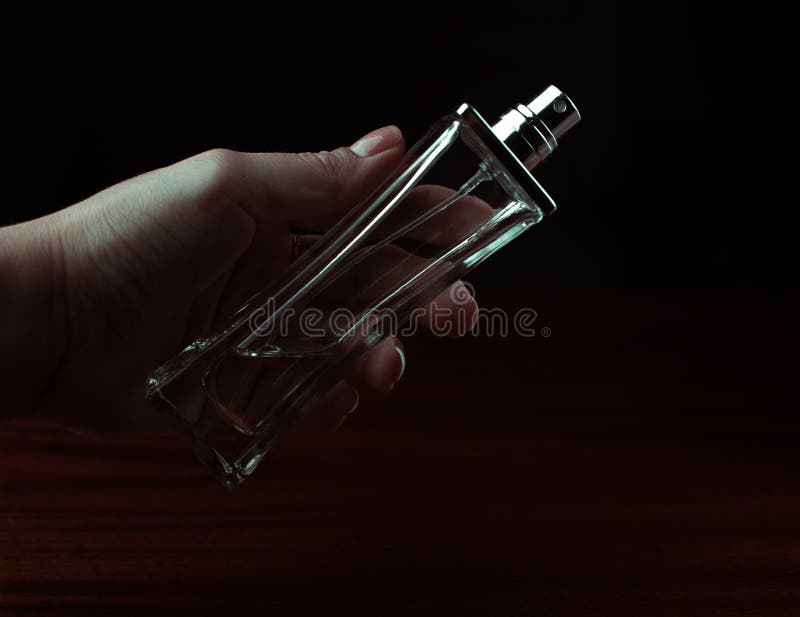 Perfume in hand stock image. Image of beauty, cosmetic - 66781579