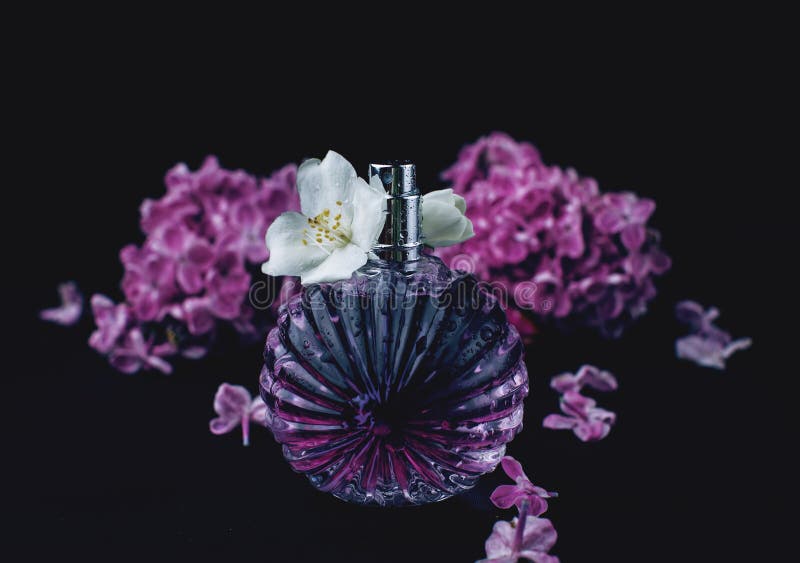 Perfume and purple flowers stock photo. Image of cluster - 71839876