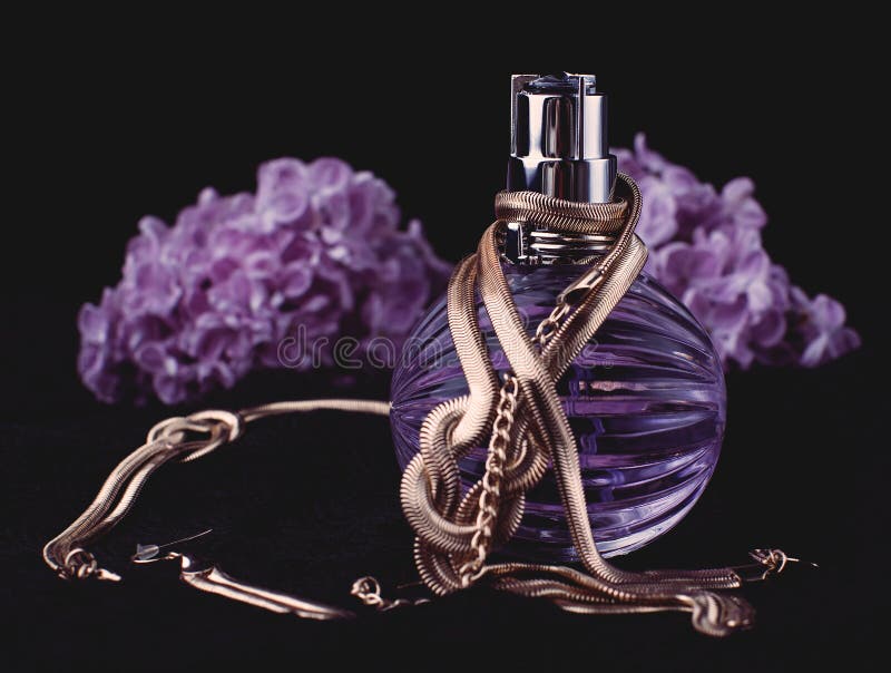 Perfume and purple flowers stock photo. Image of cluster - 71839876