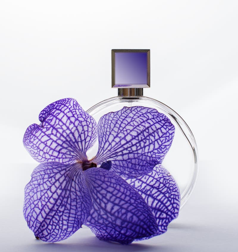 Perfume and purple orchids stock photo. Image of merchandise - 61256956