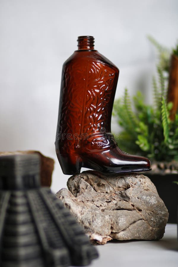 Perfume in the Shape of a Boot and Various Objects Stock Photo - Image ...