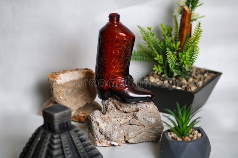 Perfume in the Shape of a Boot and Various Objects Stock Photo - Image ...
