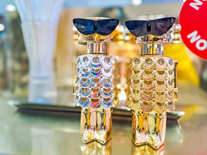 Perfume in the Shape of Robots, Silver and Gold with Tinted Glasses ...