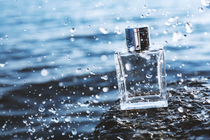 Perfume on blue background stock image. Image of summer - 132254401