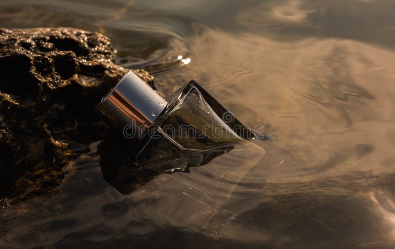 Perfume on stone stock image. Image of atomizer, luxury - 124399023