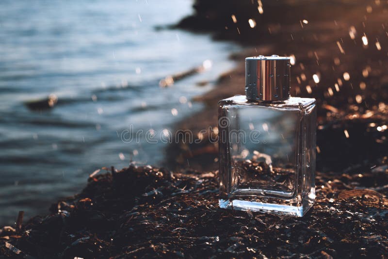 Perfume with Water Splash on Sunset Background Stock Image - Image of ...