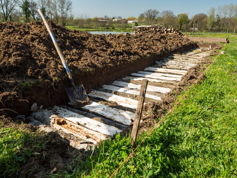 Permaculture Trench Construction with Half Long Logs of Wood Stock ...
