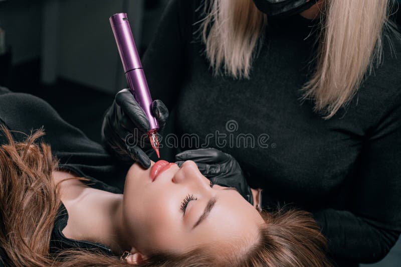 Permanent lip makeup. stock image. Image of hand, makeup - 265675953