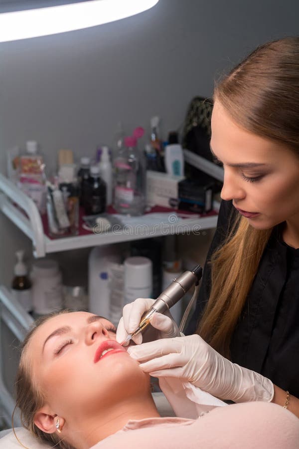 Permanent Make Up Procedure. Lip Makeup in Tattoo Salon Stock Photo ...