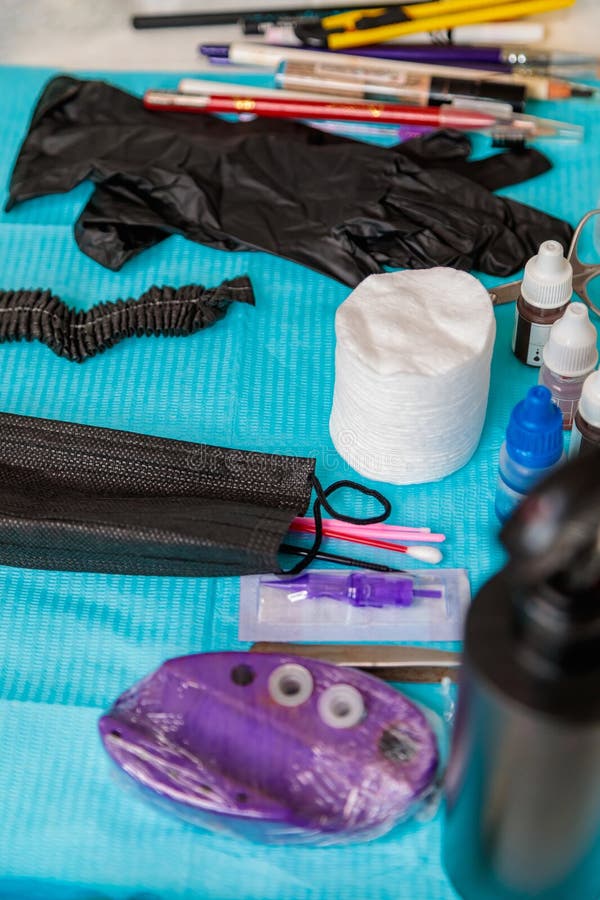 Permanent Makeup Artist Arranging Tools and Equipment on Work Surface ...