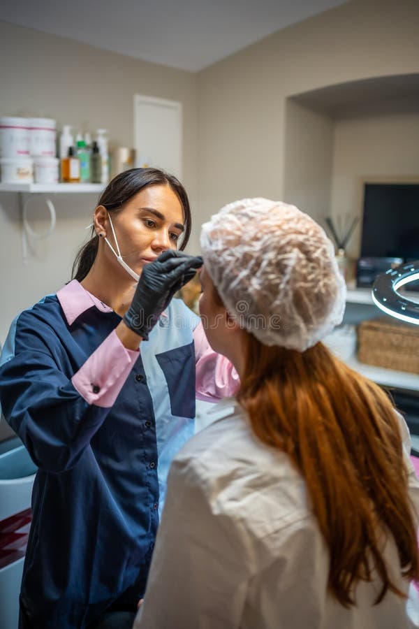 Permanent Makeup Cosmetologist Master Takes Measurements for the New ...