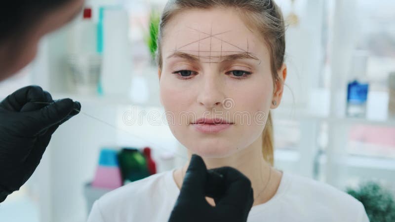 Cosmetologist Making Eyebrow Permanent Makeup Stock Video - Video of ...
