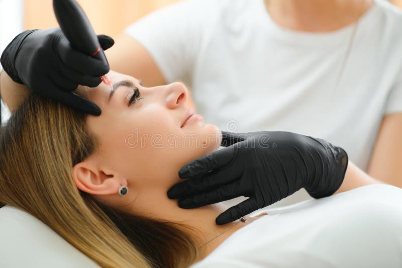 Permanent Makeup. Permanent Tattooing of Eyebrows Stock Photo - Image ...