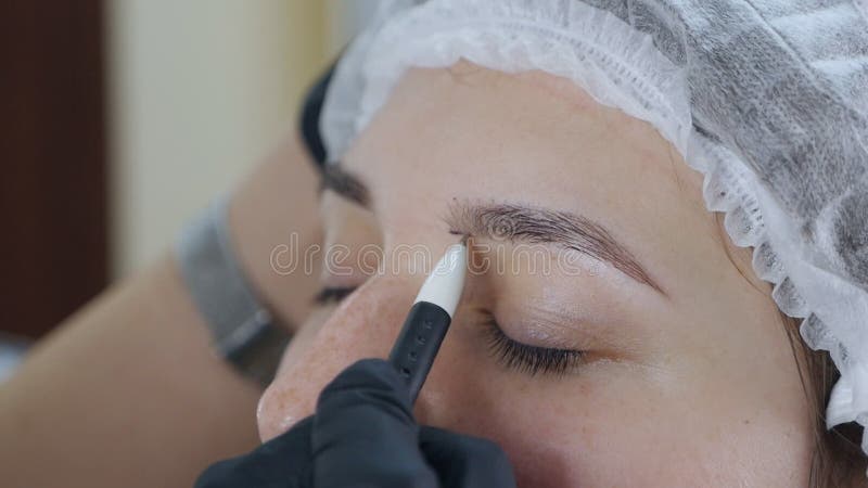 The Permanent Master Draws Lines on the Client S Face with Threads ...