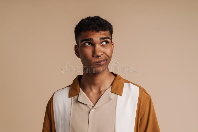 Black Perplexed Woman Pointing Finger Away while Holding Copyspace ...