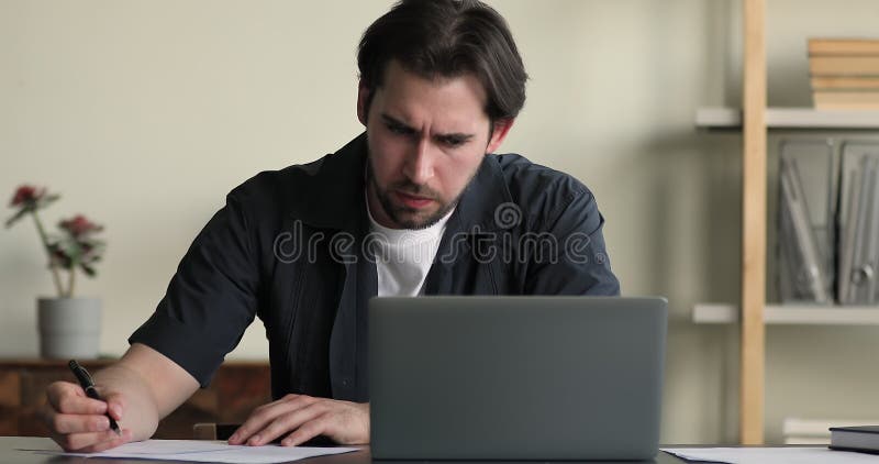 Perplexed Employee Sit at Desk Do Paperwork, Faced with Problem Stock ...