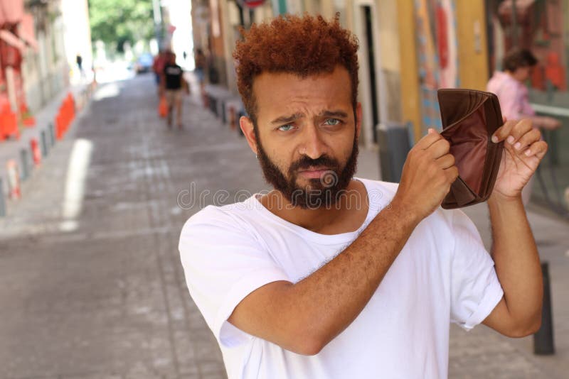 Perplexed Male Holding His Empty Wallet Stock Image - Image of baffled ...