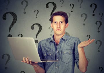 Perplexed Man with Laptop Many Questions and No Answer Stock Photo ...