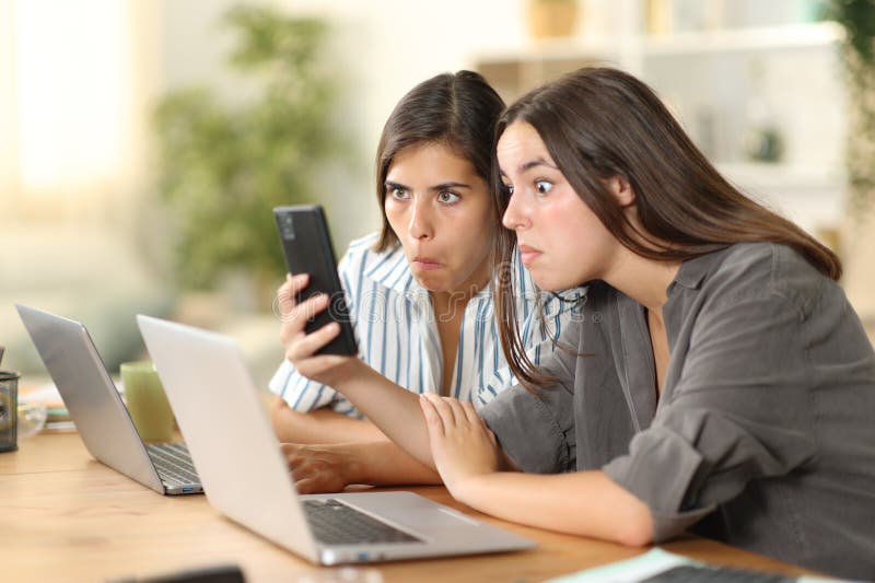 Perplexed Tele Workers Checking Phone at Home Stock Image - Image of ...