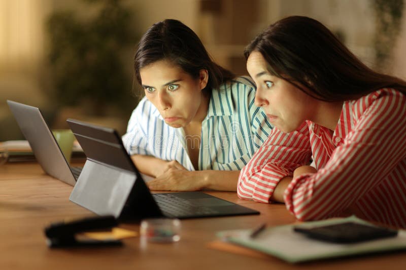 Perplexed Tele Workers Watching Media in the Night Stock Photo - Image ...