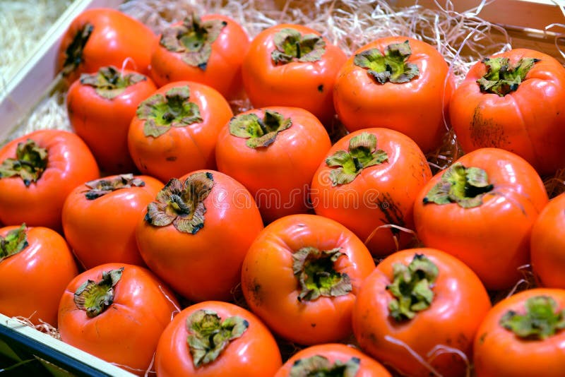 Persimmon in a box stock photo. Image of persimmon, exotic - 31777224