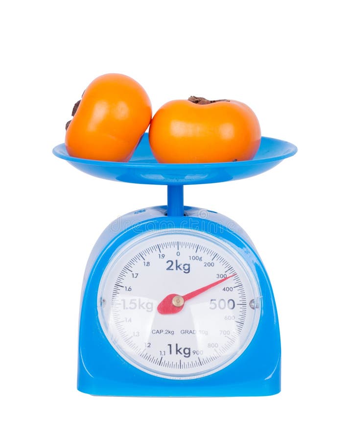 Persimmon on Kitchen Scale Isolated on White Background Stock Photo ...