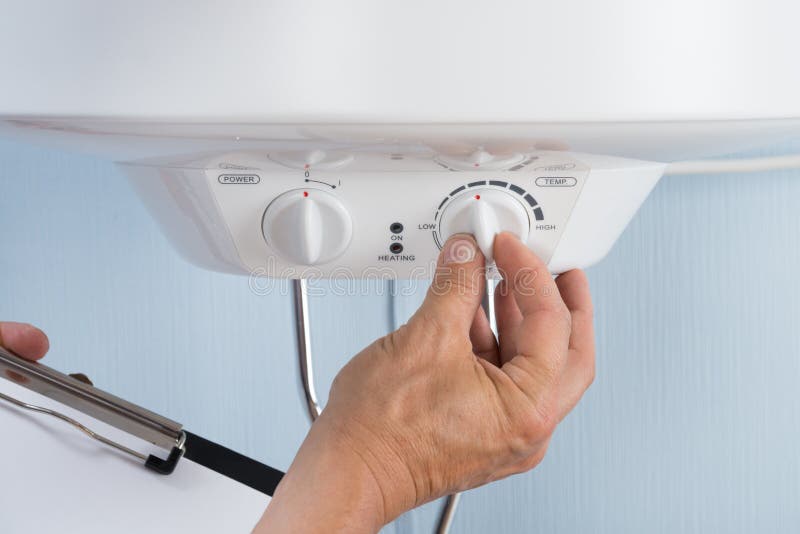 Person Adjusting Temperature of Electric Boiler Stock Image - Image of ...
