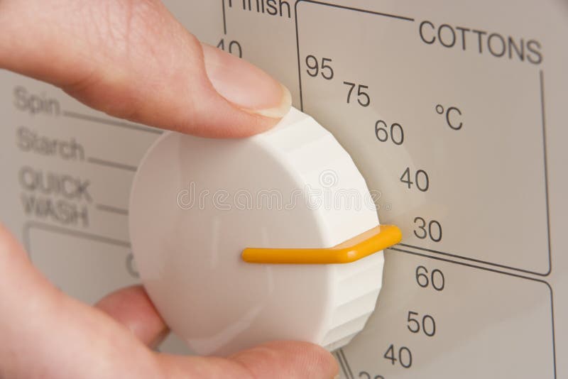 Person Adjusting Washing Machine Dial To Cold Wash Stock Photo - Image ...