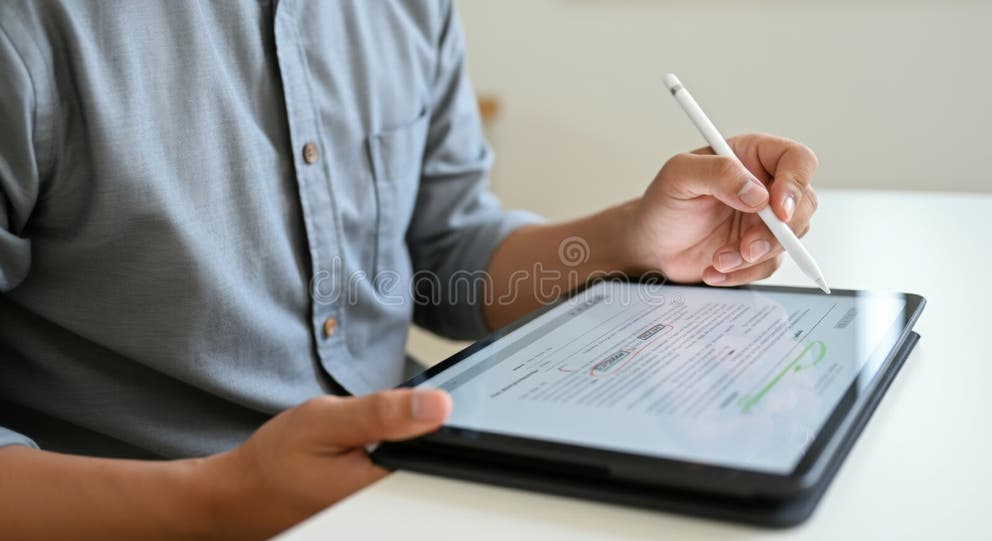 Person Annotating Document on Tablet with Stylus in Office Setting ...