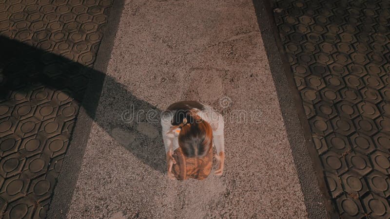Person with Backpack Sitting on Pathway Viewed from Above Stock Video ...