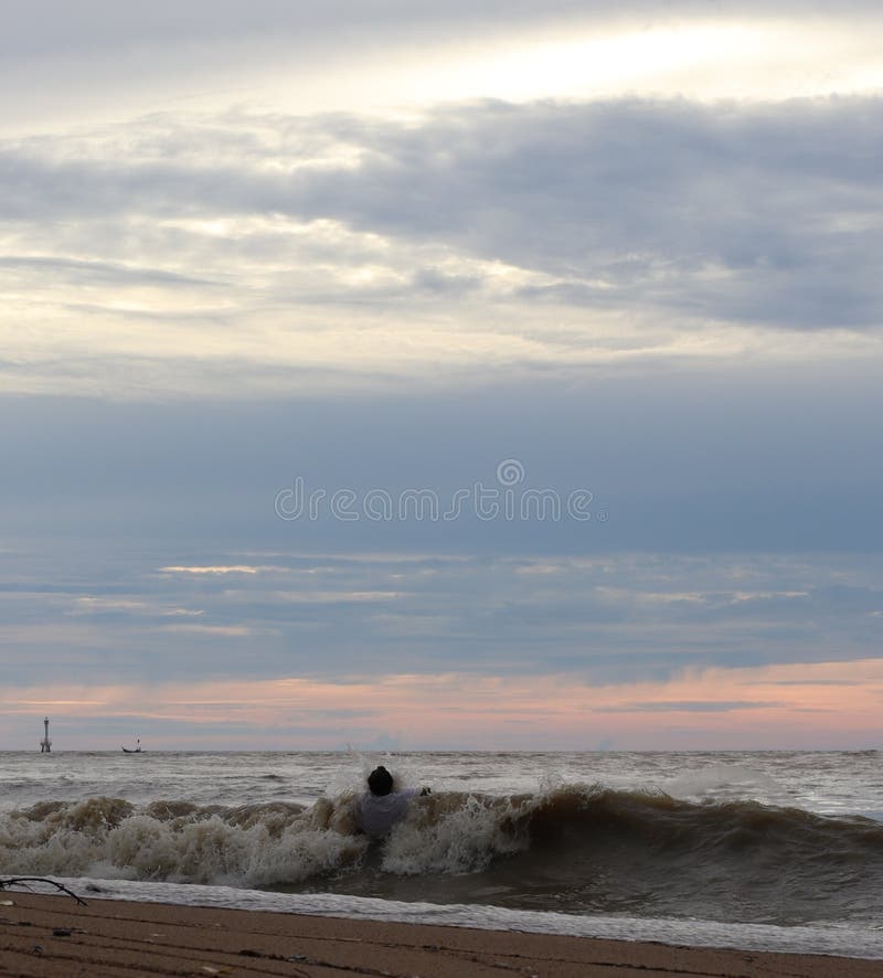 Person at the Beach Hit by the Wave during High Tide Stock Photo ...