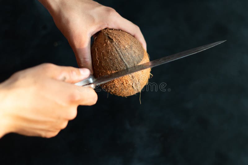 Person with Big Knife Try To Open and Break a Coconuts Stock Image ...