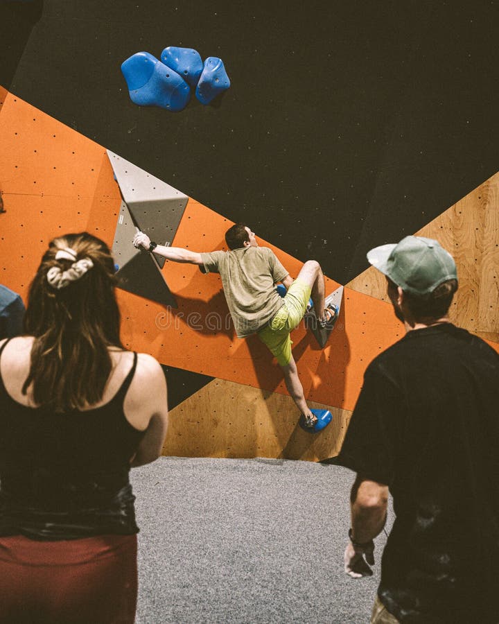 Person Bouldering on an Indoor Climbing Wall Stock Photo - Image of ...