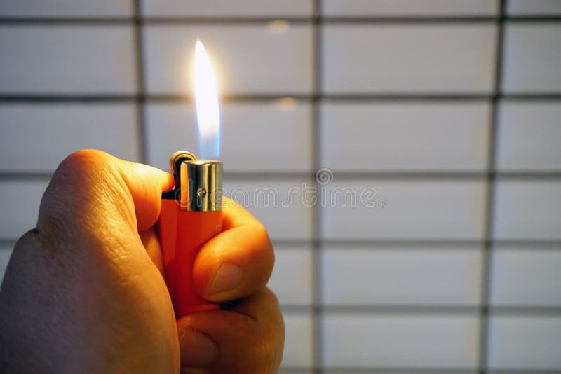 Person burning a lighter stock photo. Image of smoke - 257585284