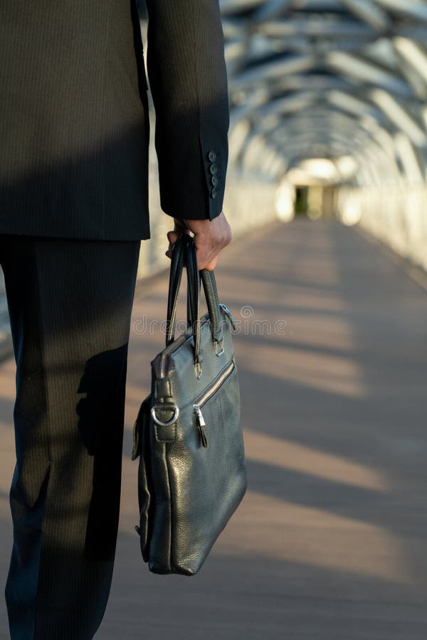 A Person Carrying Black Leather Handbag Stock Image - Image of holding ...