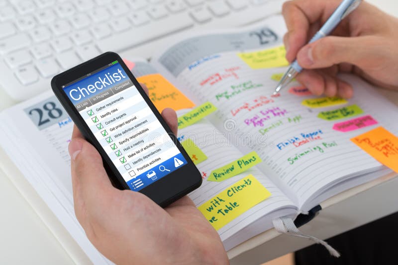 Person Checking List from Mobile Phone and Diary Stock Image - Image of ...