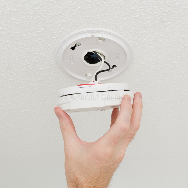 Checking Smoke Detector stock photo. Image of device - 264027704