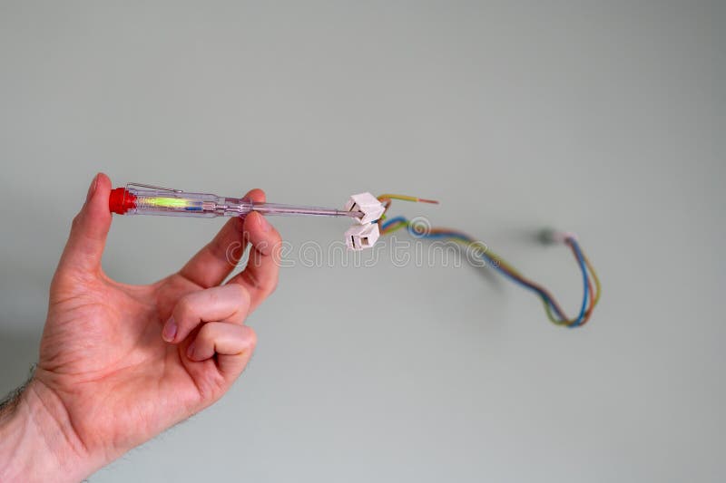 Person Checks with an Electrical Line Tester the Current, before the ...