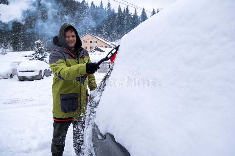 Person Clearing Snow from Car in Winter Landscape Stock Photo - Image ...