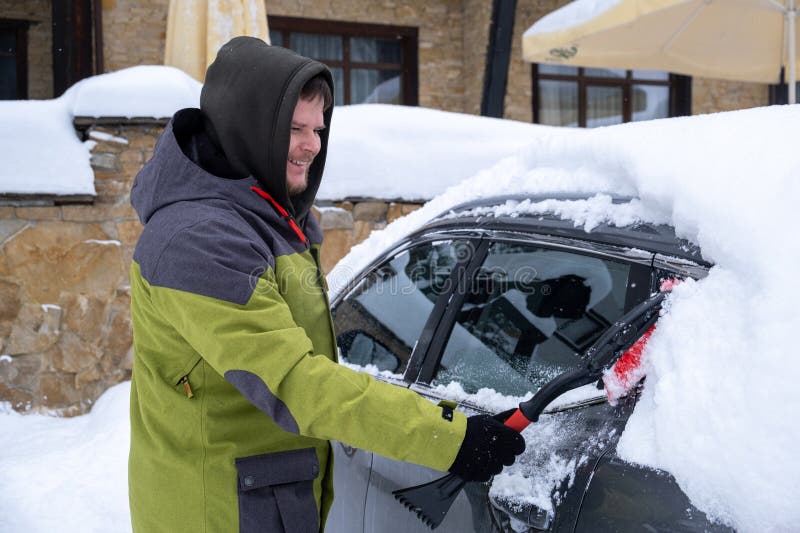 Person Clearing Snow from Car in Winter Landscape Stock Image - Image ...