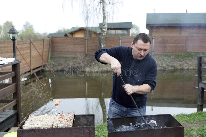 Person cooking chicken stock photo. Image of outdoor - 70909326