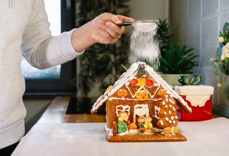 Person Cooking Gingerbread House in the Kitchen Stock Photo - Image of ...