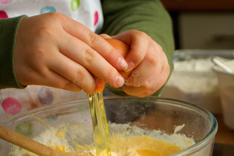 A Person Cracking an Egg into a Bowl. Stock Image - Image of intio ...