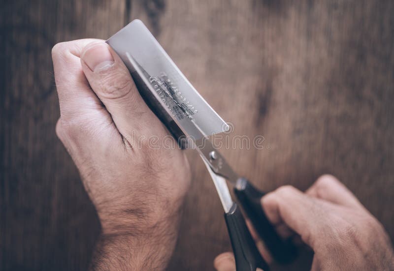 Person Cutting Credit Card into Half with Scissors Stock Photo - Image ...