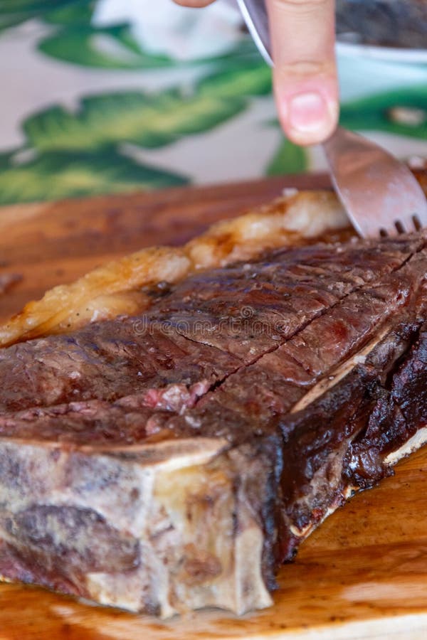 A Person Cutting a Grilled Old Beef Steak Stock Image - Image of grid ...